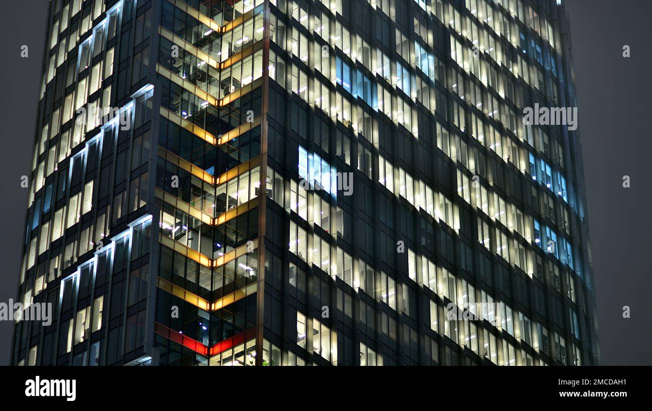 Modern office building in city at the night. View on illuminated ...