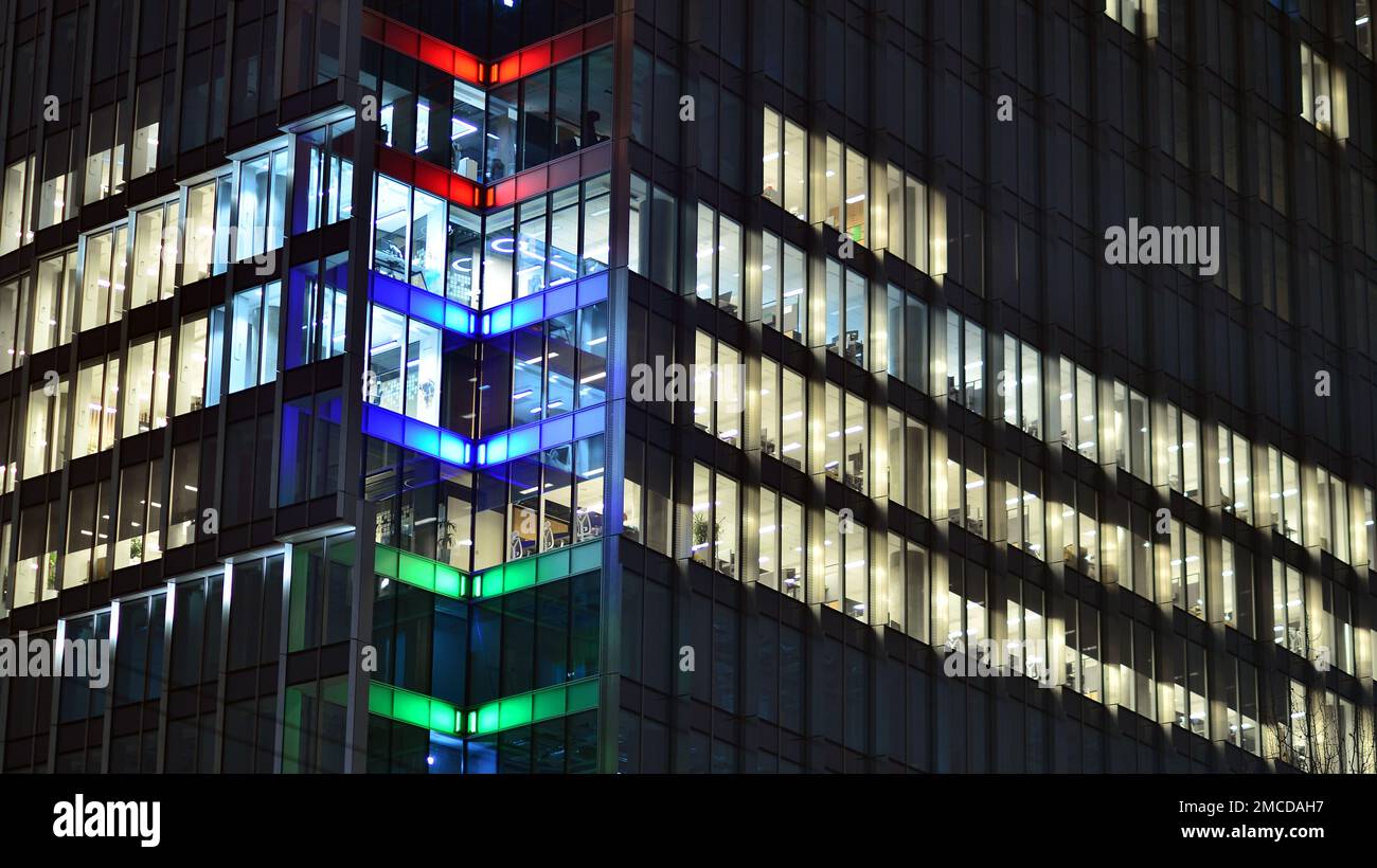 Modern office building in city at the night. View on illuminated ...