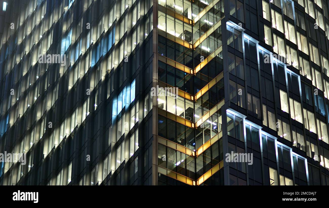Modern office building in city at the night. View on illuminated ...