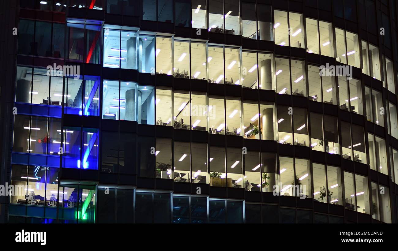 Modern office building in city at the night. View on illuminated ...