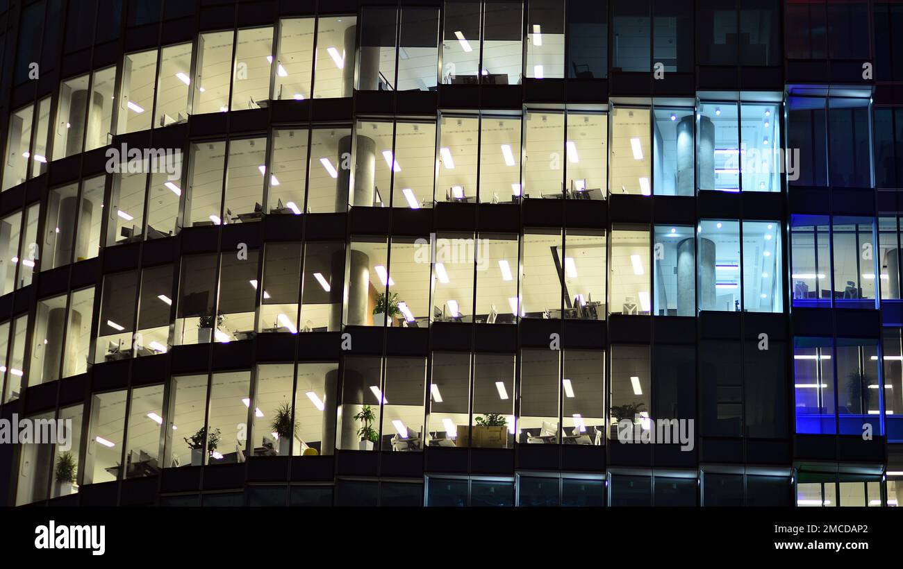 Modern office building in city at the night. View on illuminated ...