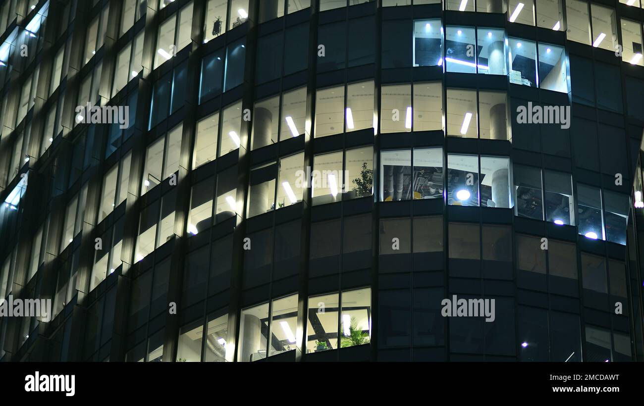 Modern office building in city at the night. View on illuminated ...