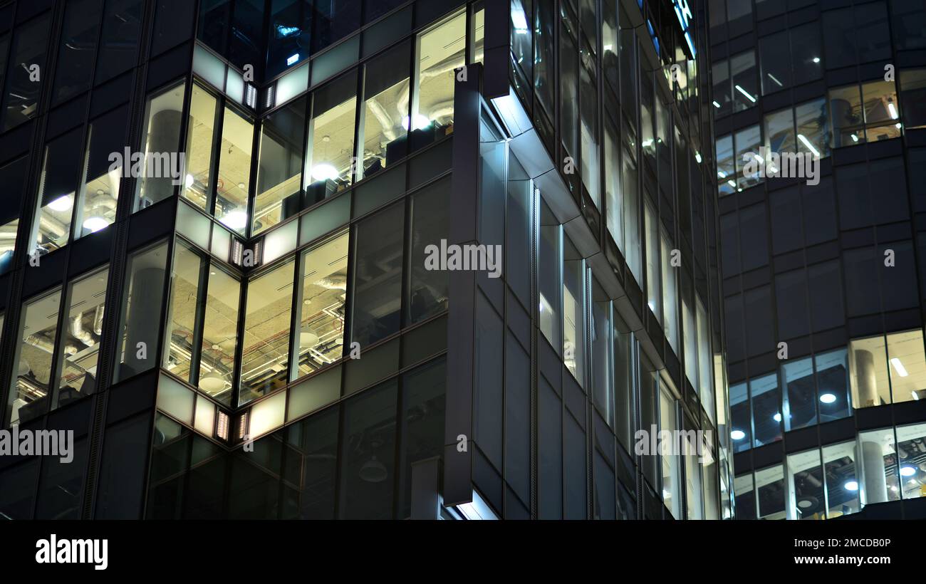 Modern office building in city at the night. View on illuminated ...