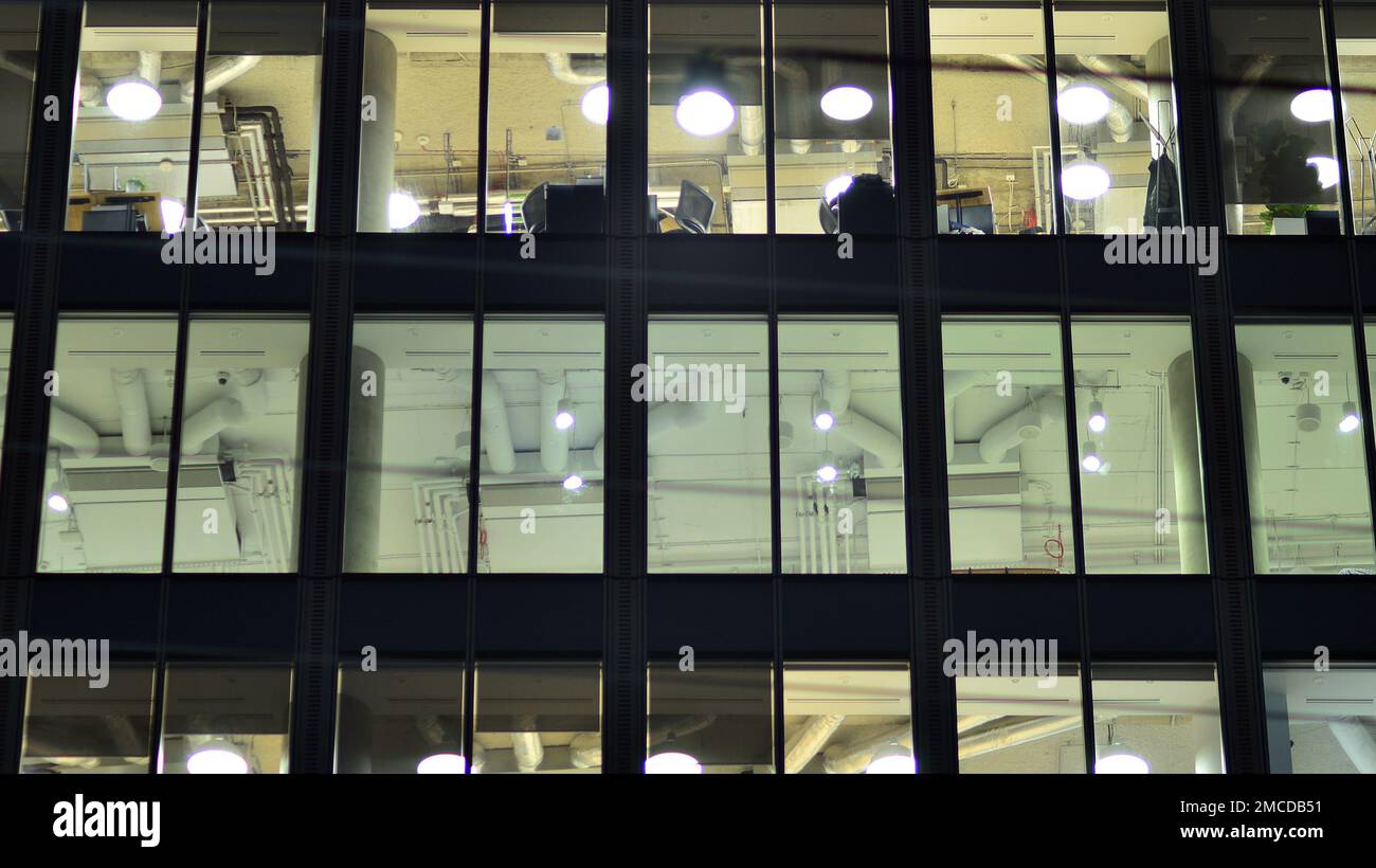 Modern office building in city at the night. View on illuminated ...