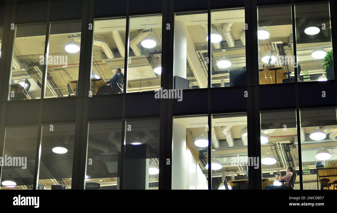 Modern office building in city at the night. View on illuminated ...
