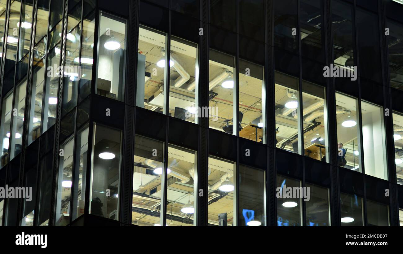 Modern office building in city at the night. View on illuminated ...