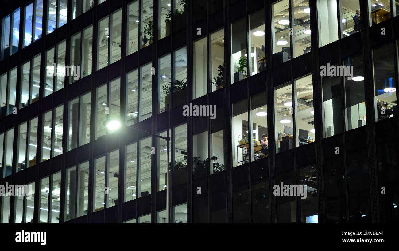 Modern office building in city at the night. View on illuminated ...