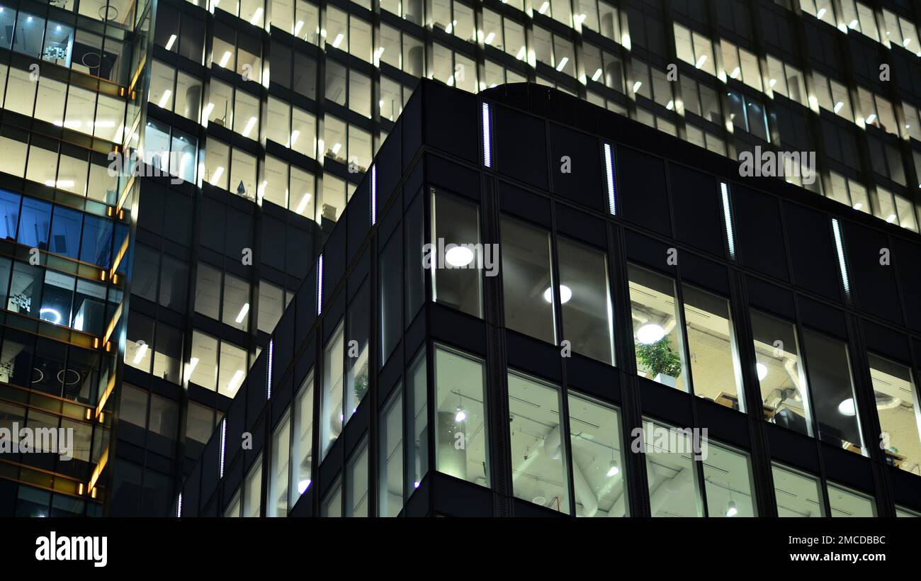 Modern office building in city at the night. View on illuminated ...