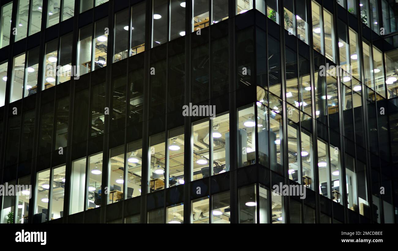 Modern office building in city at the night. View on illuminated ...
