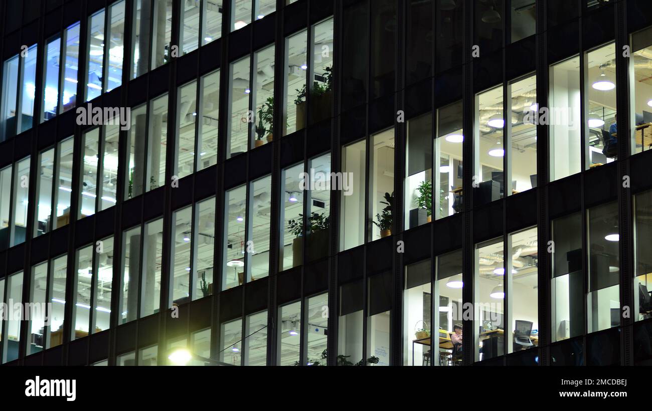 Modern office building in city at the night. View on illuminated ...