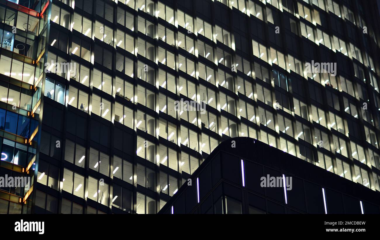 Modern office building in city at the night. View on illuminated ...