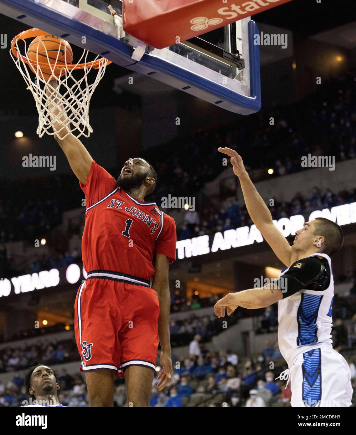 St. John's Aaron Wheeler (1) dunks against Creighton's Rati ...