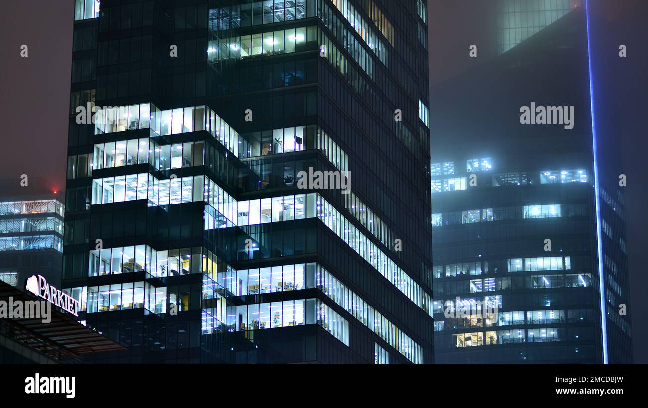 Modern office building in city at the night. View on illuminated ...