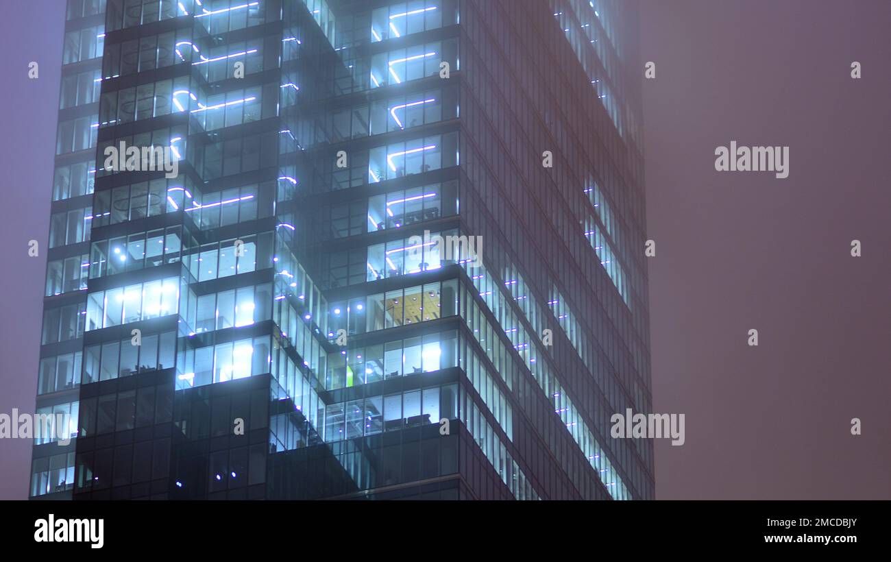 Modern office building in city at the night. View on illuminated ...