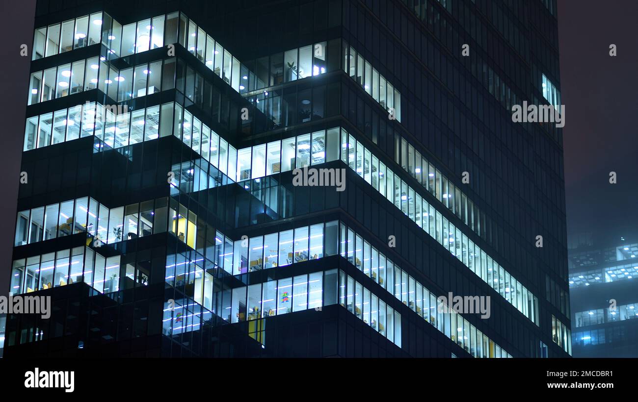 Modern office building in city at the night. View on illuminated ...