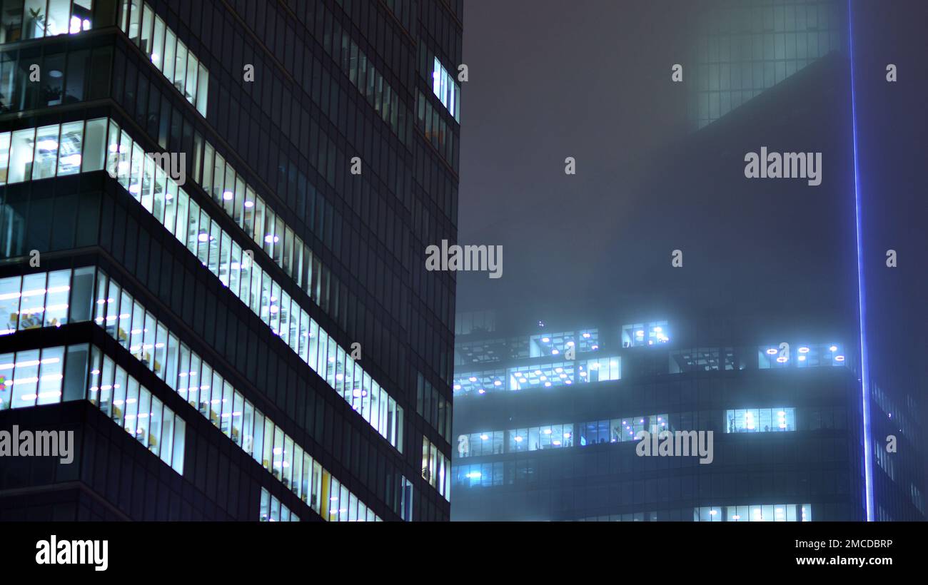 Modern office building in city at the night. View on illuminated ...
