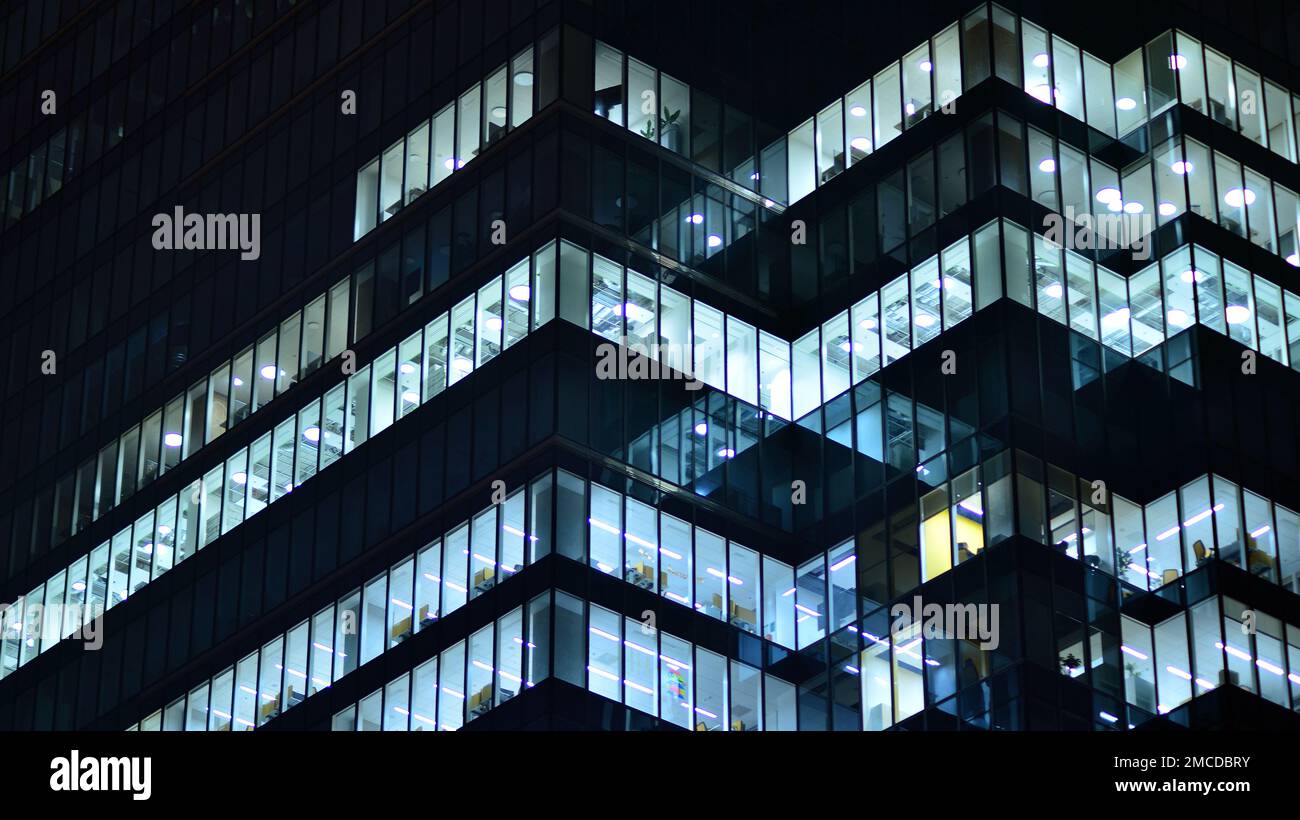 Modern office building in city at the night. View on illuminated ...