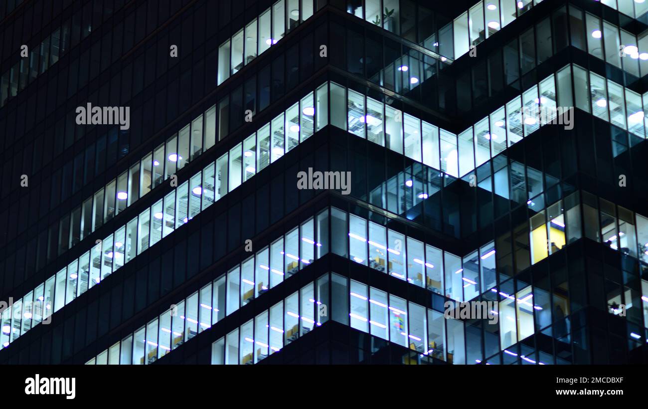 Modern office building in city at the night. View on illuminated ...