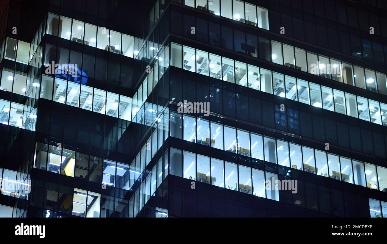 Modern office building in city at the night. View on illuminated ...