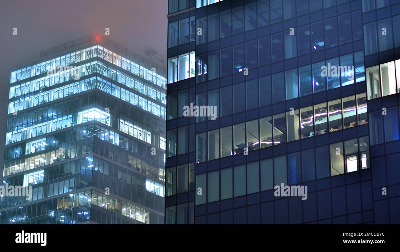 Modern office building in city at the night. View on illuminated ...