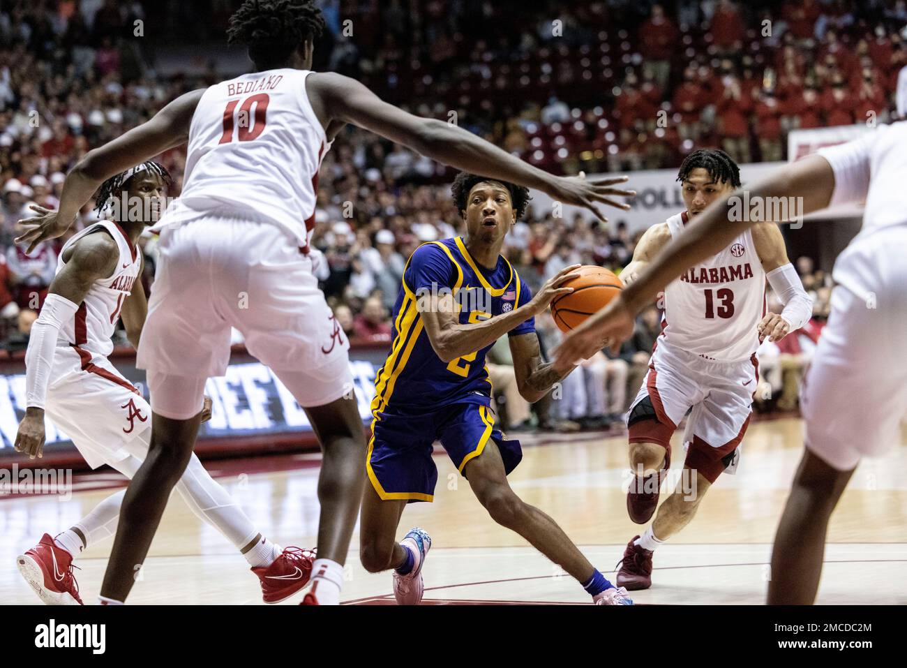 LSU guard Eric Gaines (2) works inside past Alabama guards Keon Ellis ...