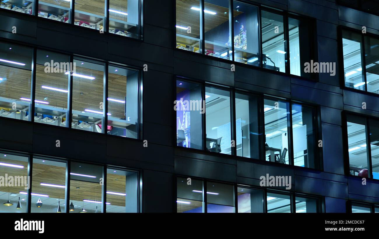 Modern office building in city at the night. View on illuminated ...