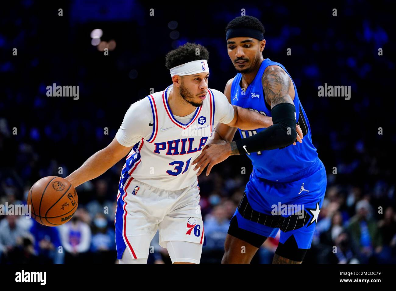 Philadelphia 76ers' Seth Curry, left, tries to get past Orlando Magic's ...