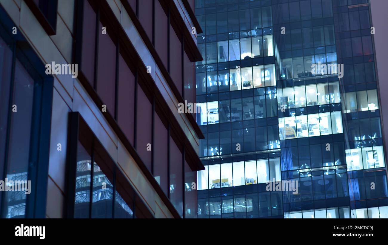 Modern office building in city at the night. View on illuminated ...
