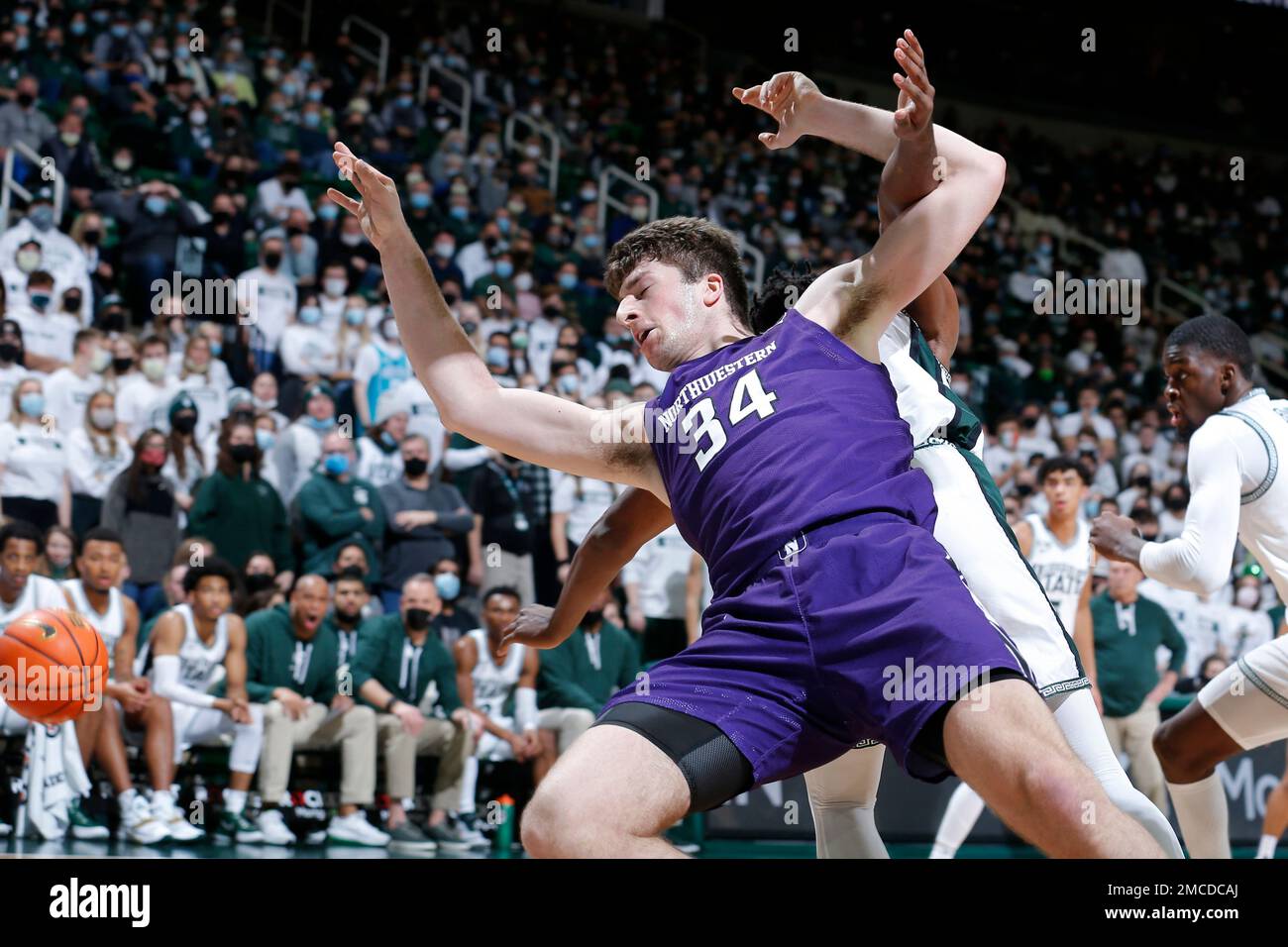 Northwestern's Matthew Nicholson (34) and Michigan State's Julius ...