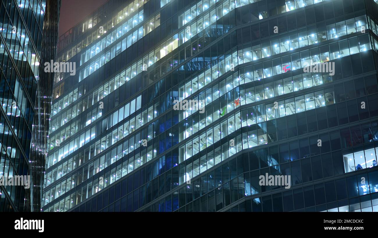 Modern office building in city at the night. View on illuminated ...