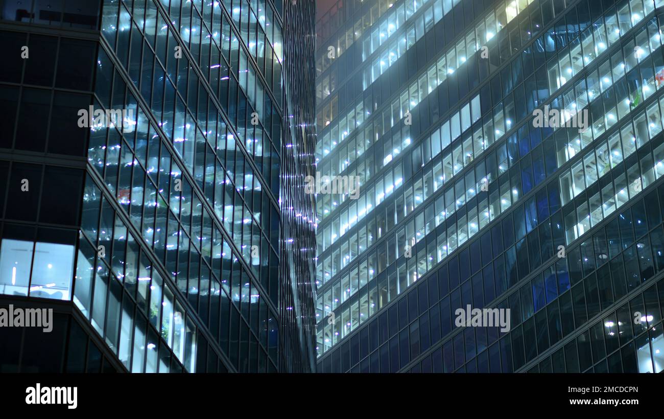 Modern office building in city at the night. View on illuminated ...