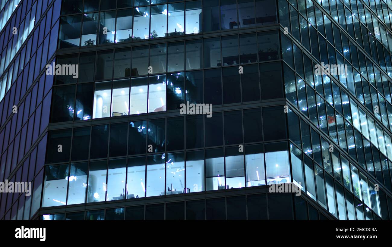 Modern office building in city at the night. View on illuminated ...