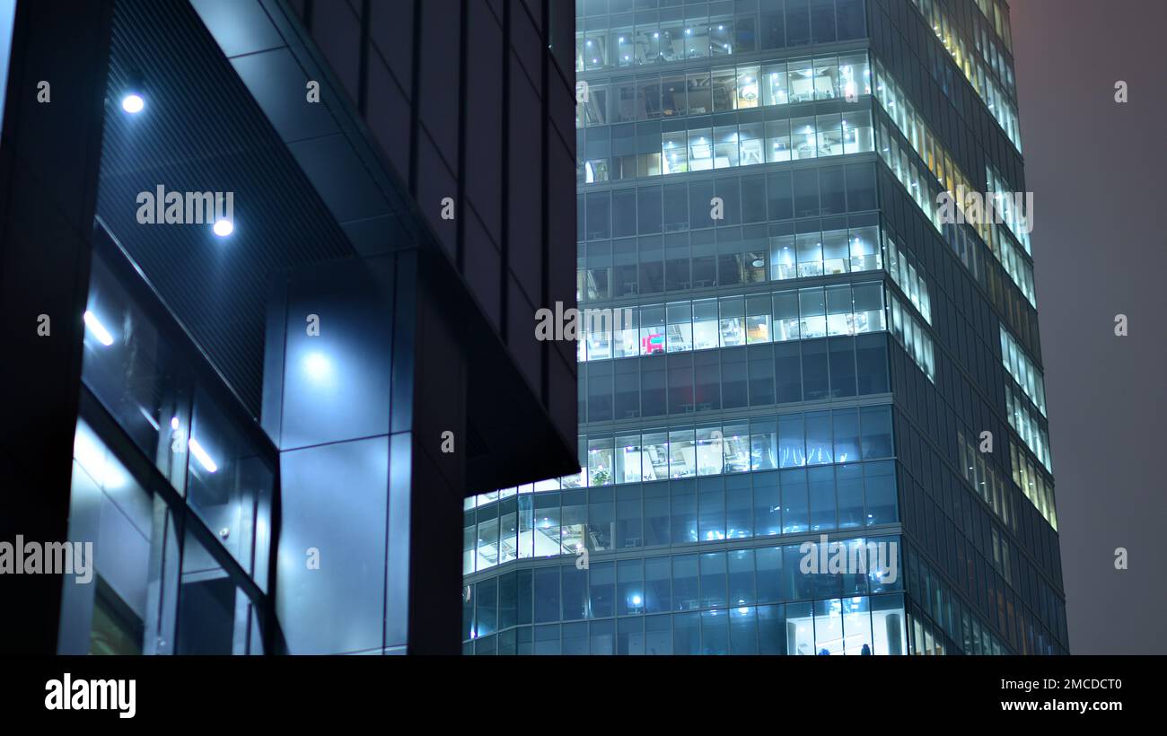 Modern office building in city at the night. View on illuminated ...