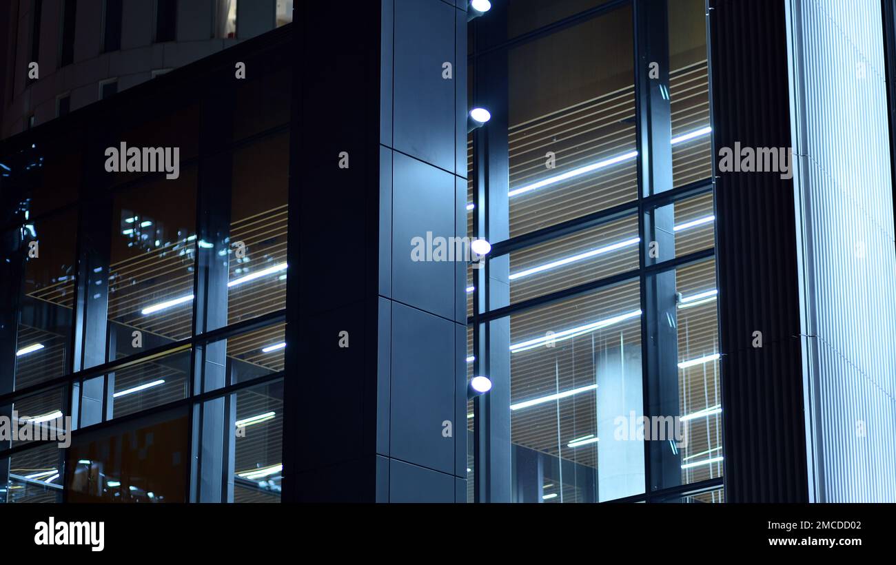 Modern office building in city at the night. View on illuminated ...