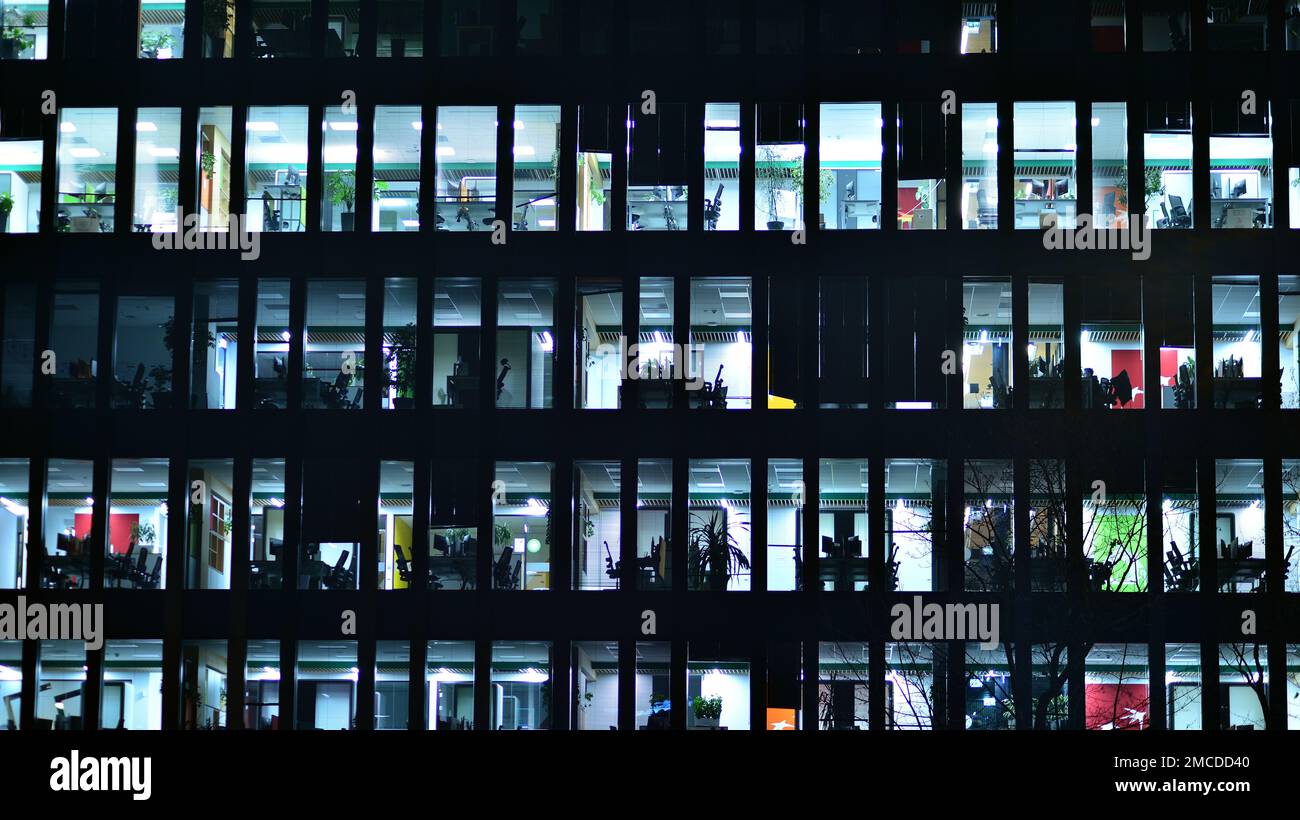 Modern office building in city at the night. View on illuminated ...