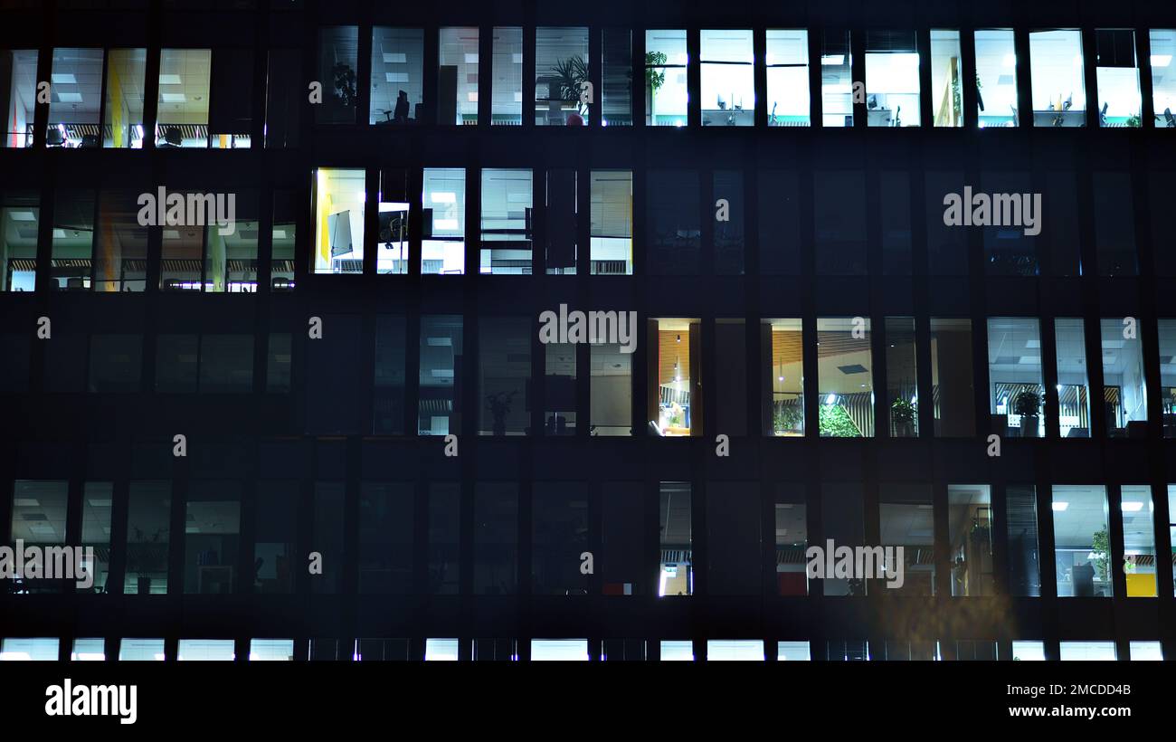 Modern office building in city at the night. View on illuminated ...