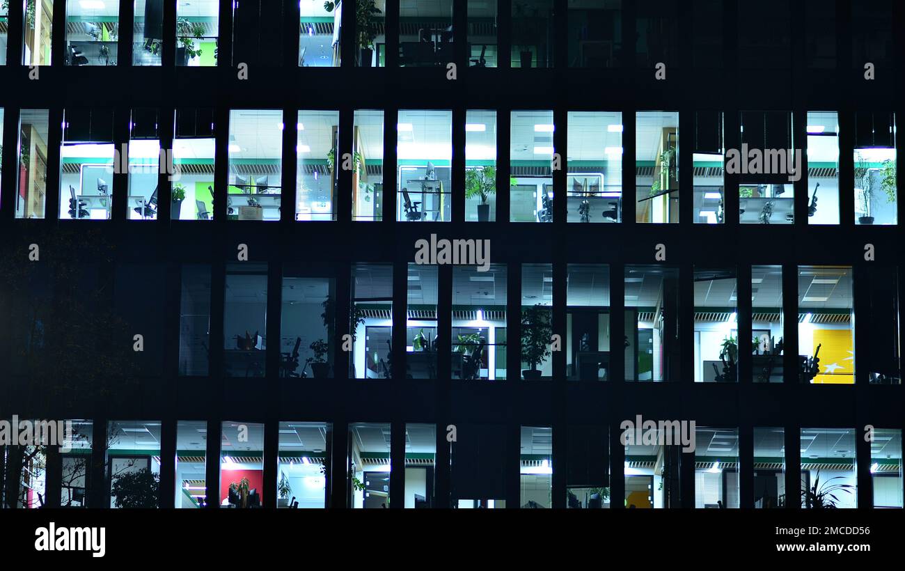 Modern office building in city at the night. View on illuminated ...