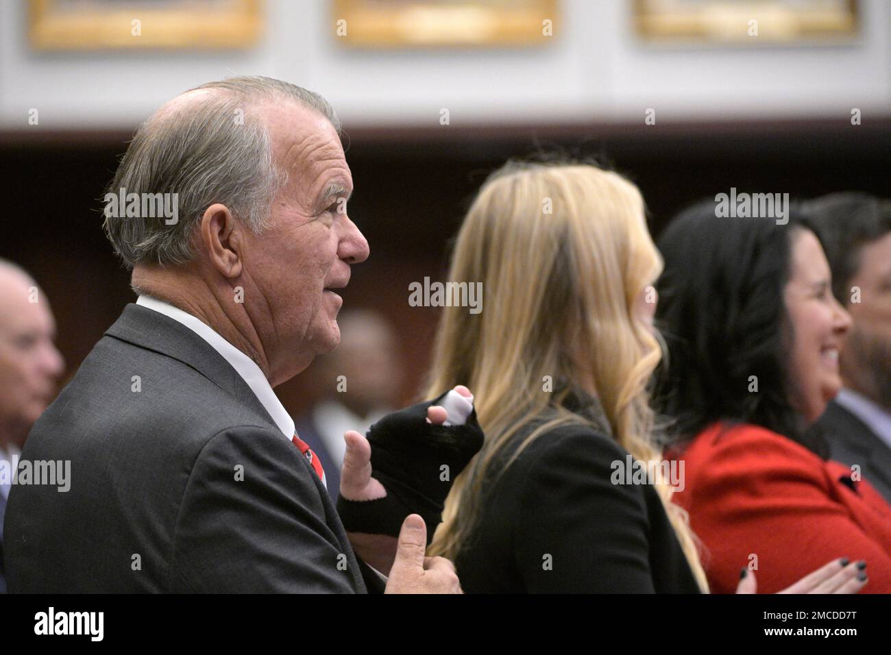 Florida Sen. Doug Broxson, front left, watches during a legislative ...