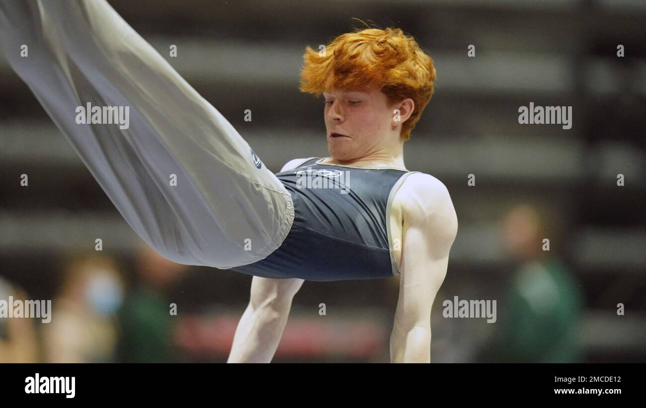 Penn State's Josh Karnes performs on the parallel bars during an NCAA ...