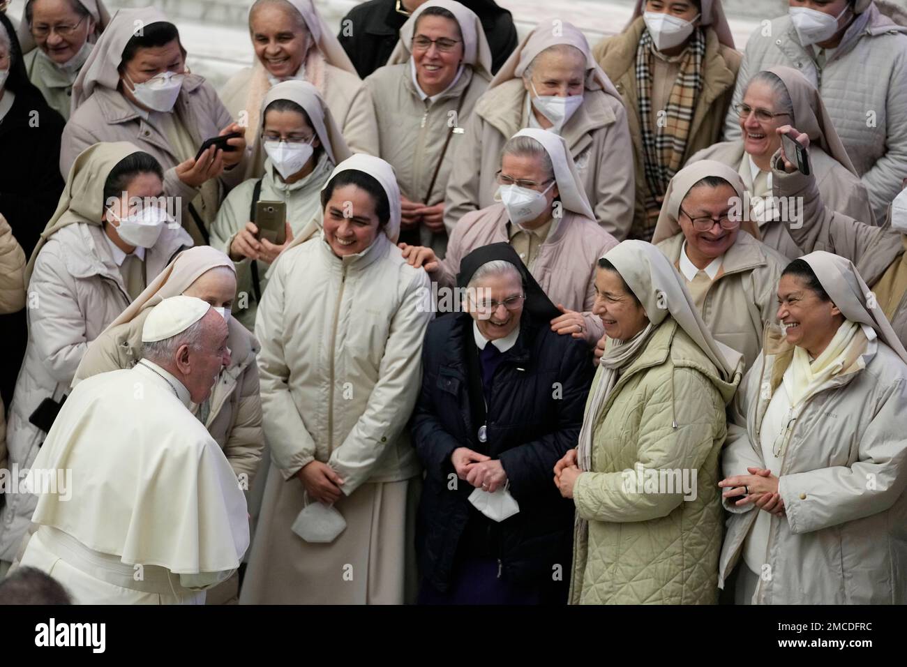 Pope Francis greets a group of nuns during his weekly general audience ...