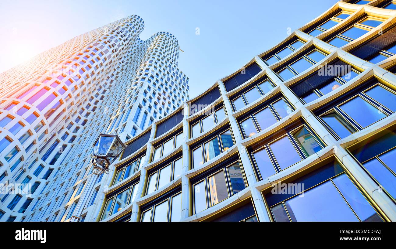 Abstract closeup of the glass-clad facade of a modern building covered ...