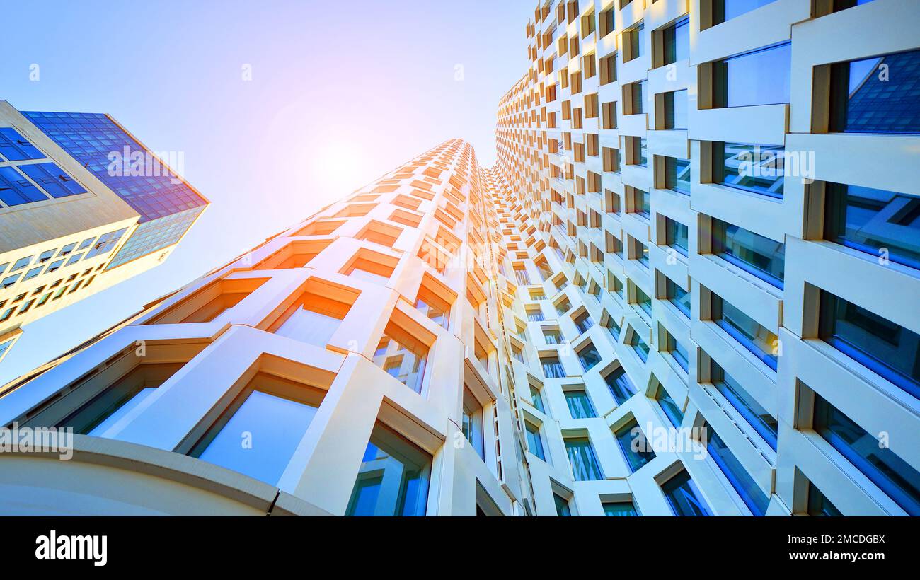 Abstract closeup of the glass-clad facade of a modern building covered ...