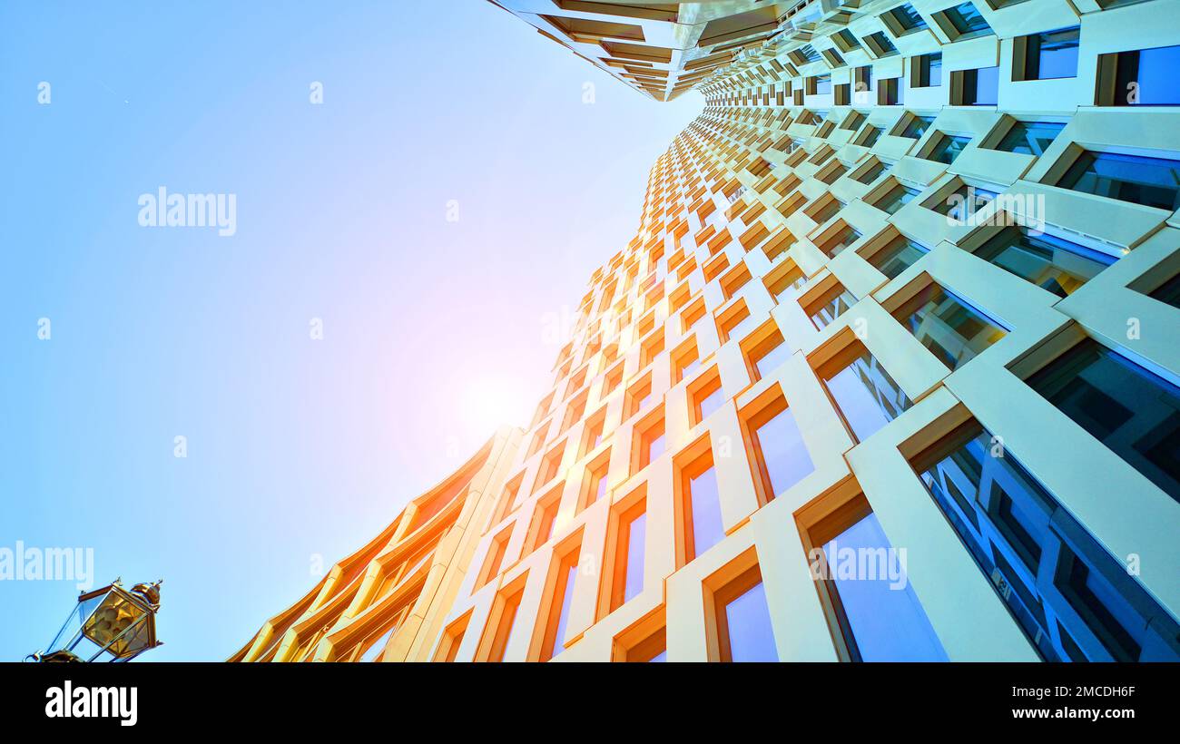 Abstract closeup of the glass-clad facade of a modern building covered ...