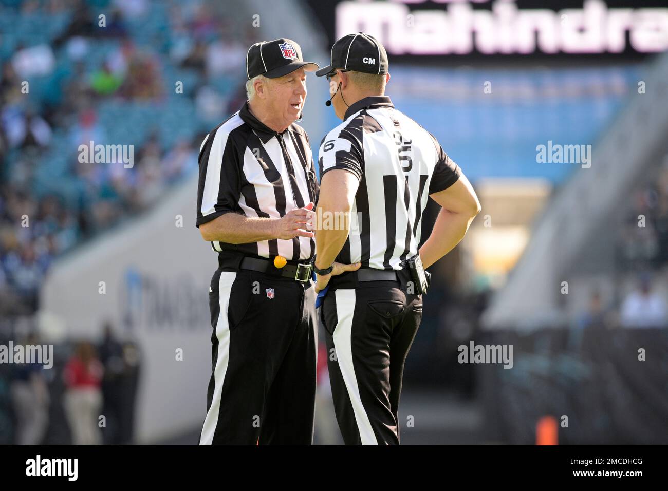 Side judge Joe Larrew, left, and down judge Jerod Phillips (6) chat on ...