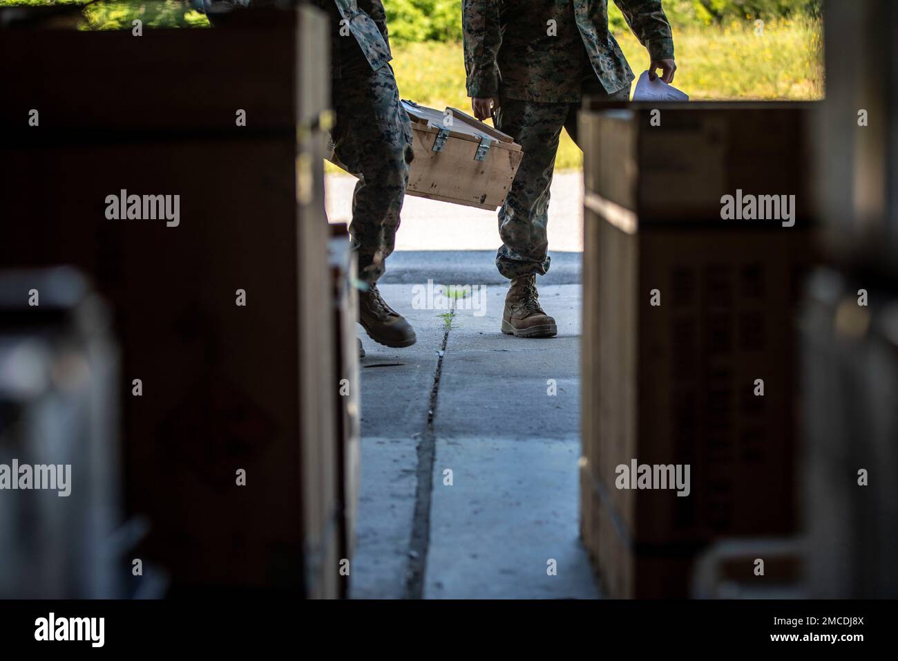 U.S. Marine Corps ammunition technicians transport ammunition from one ...