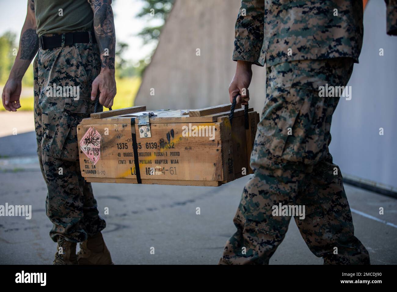 U.S. Marine Corps ammunition technicians transport ammunition from one ...