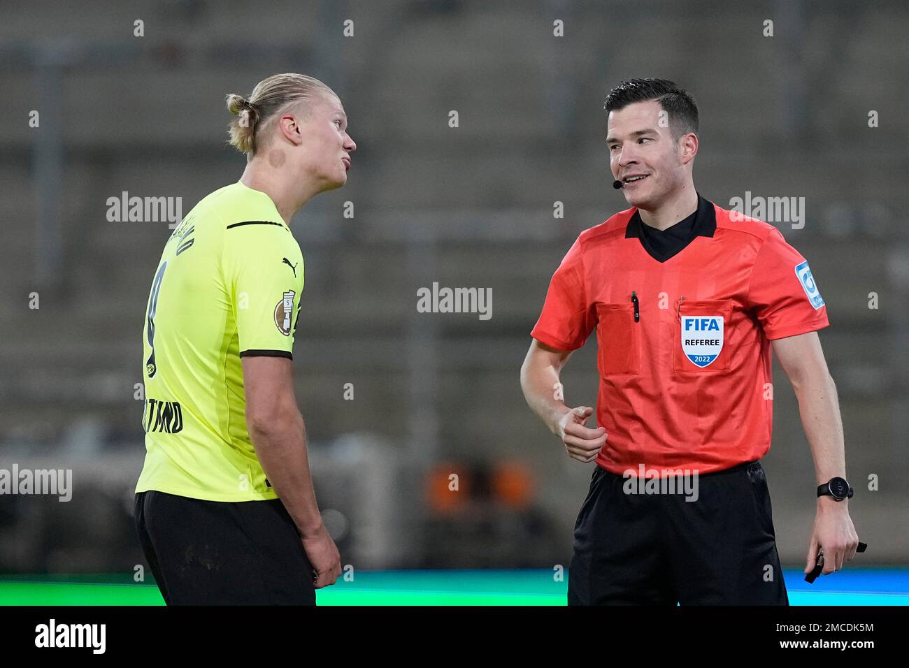 Dortmund's Erling Haaland, left, talks to referee Hans Osmers during ...