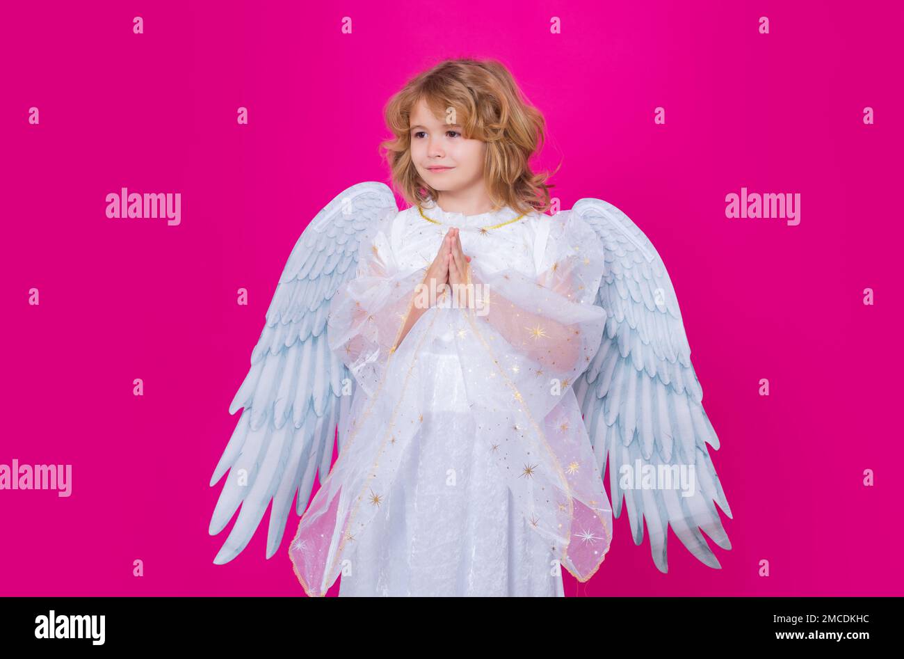 Valentines day. Little cupid angel child with wings with prayer hands ...