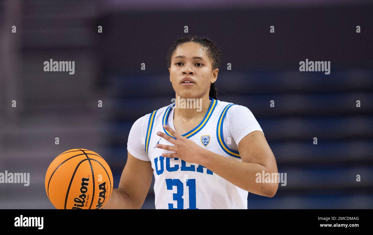 UCLA guard Jaelynn Penn (31) dribbles during an NCAA basketball game ...