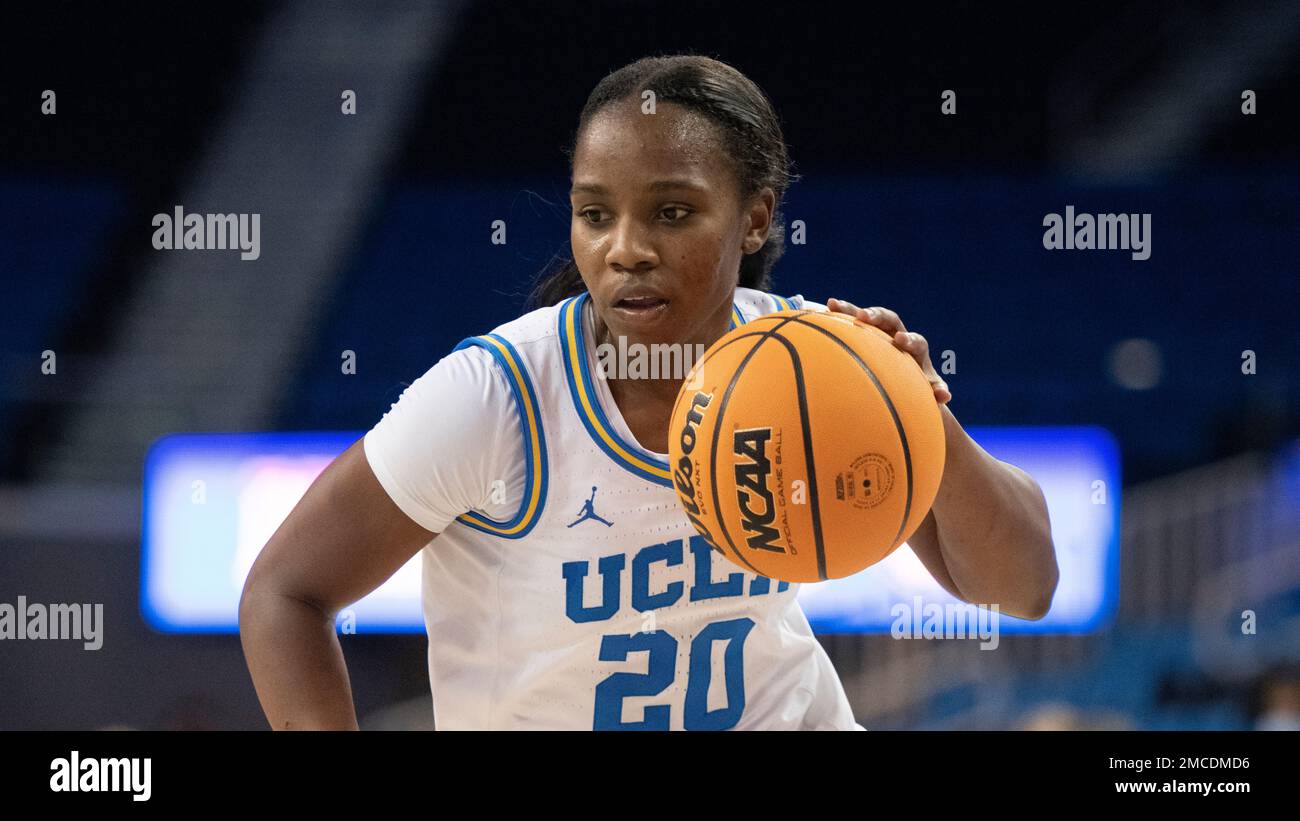UCLA guard Charisma Osborne (20) dribbles during an NCAA basketball ...